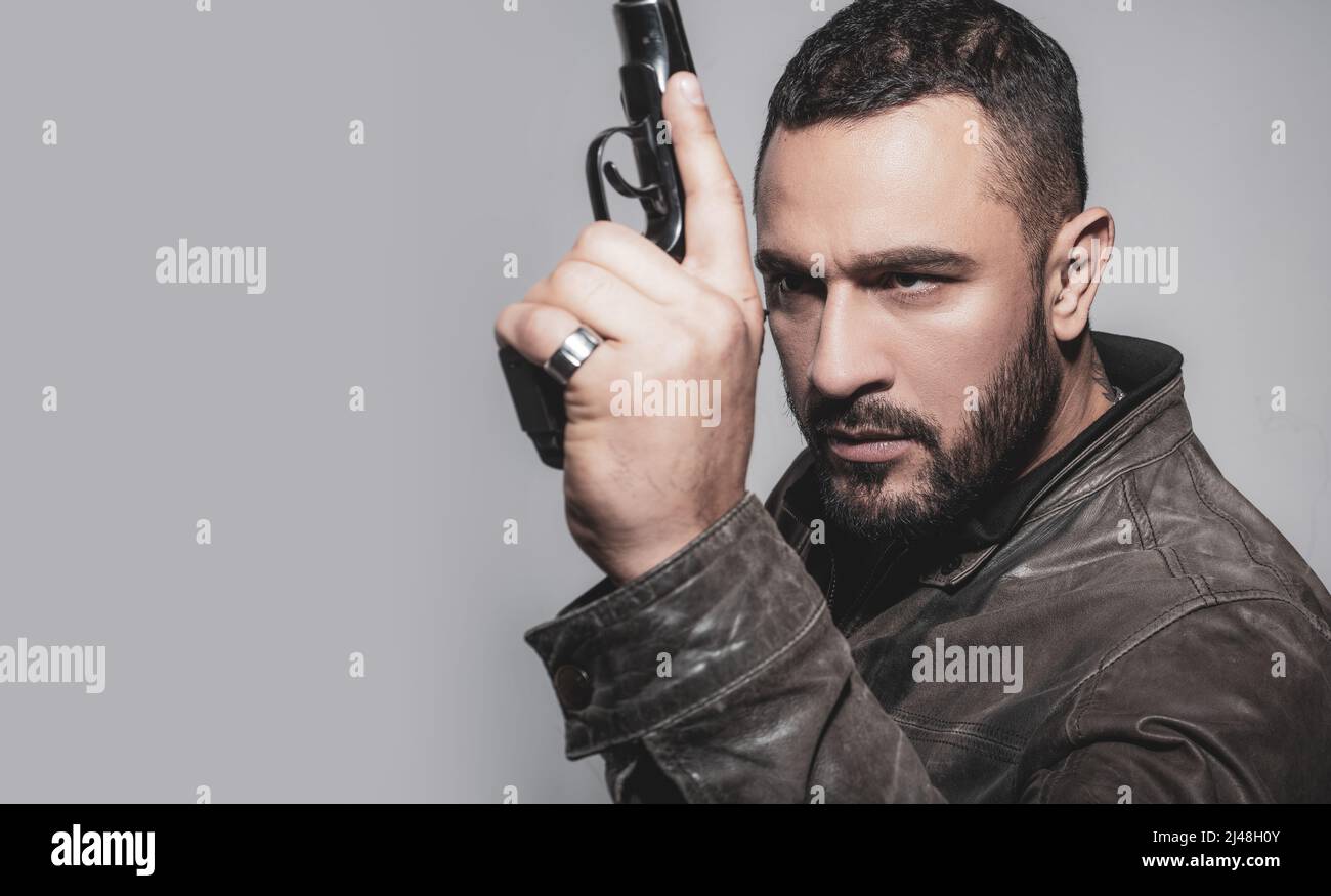 serious man with gun ready to shoot. shot. concentrated on target. copy ...