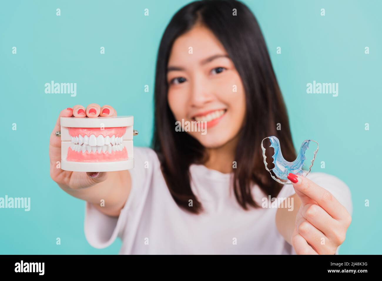 Portrait young Asian beautiful woman smiling holding silicone ...