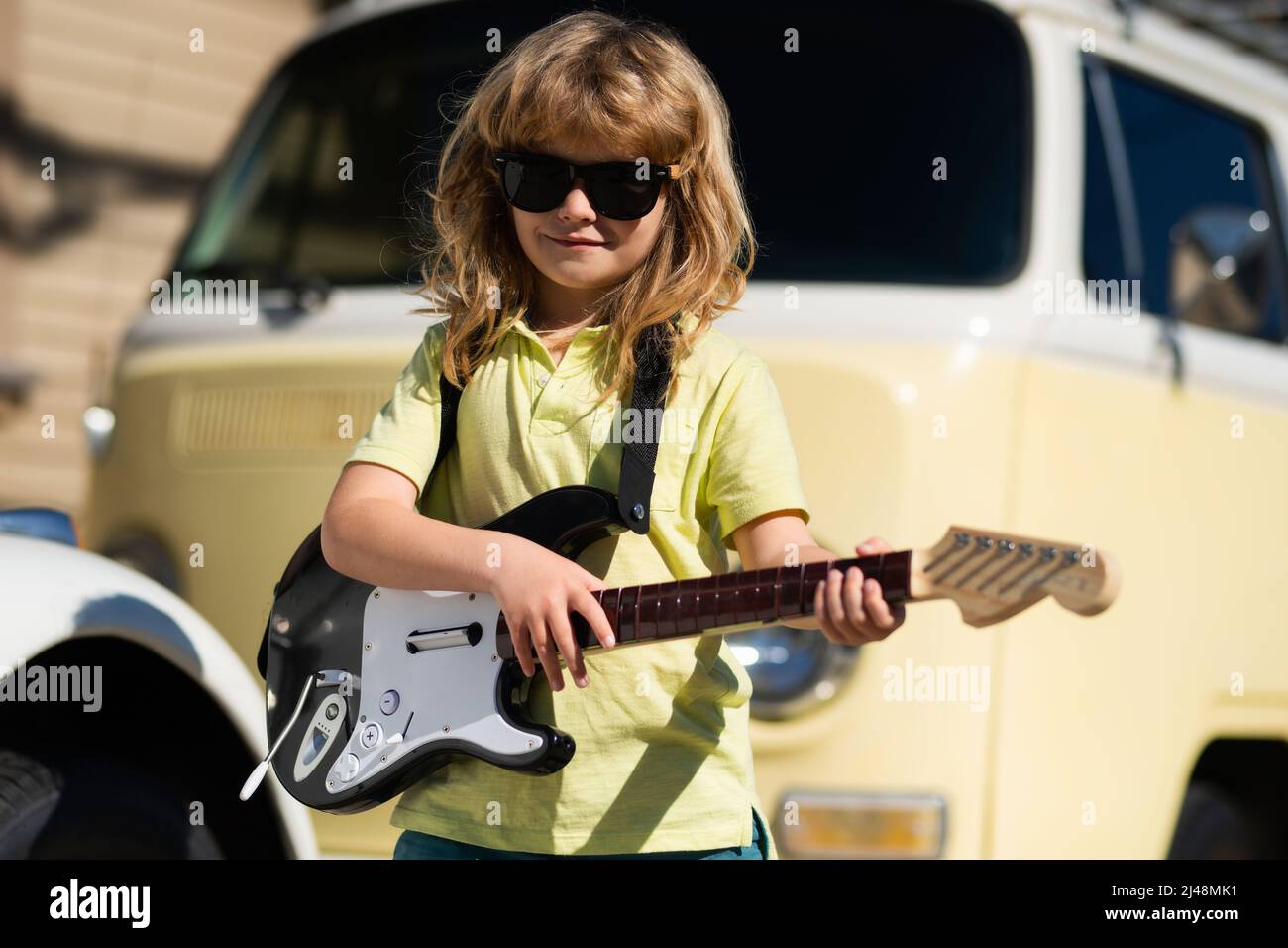 Kids musical instruments. Child musician guitarist playing electric ...