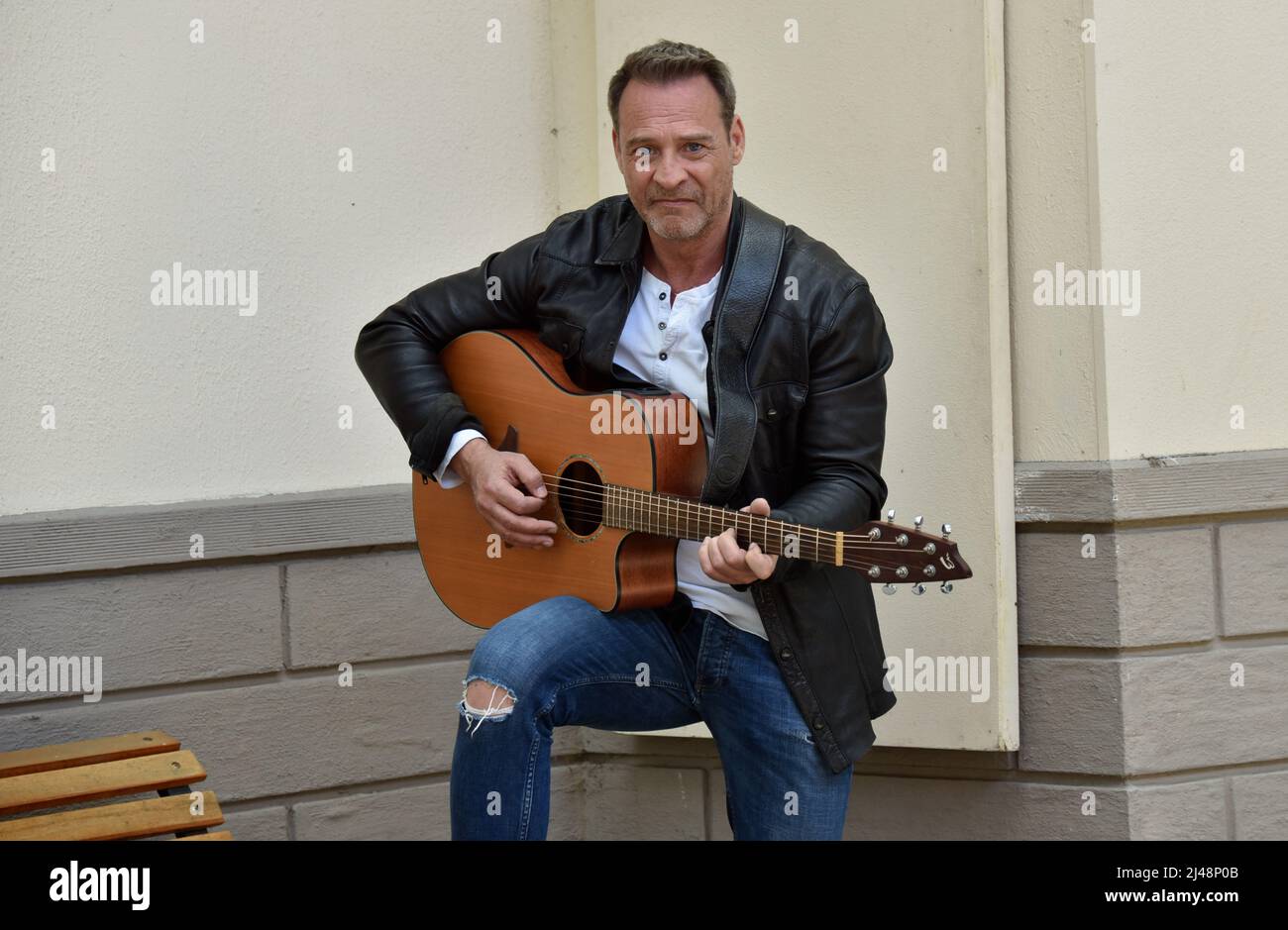 Cologne, Germany. 12th Apr, 2022. Actor Kai Noll poses with guitar in ...