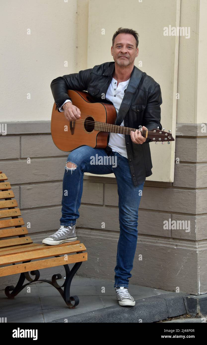 Cologne, Germany. 12th Apr, 2022. Actor Kai Noll poses with guitar in ...