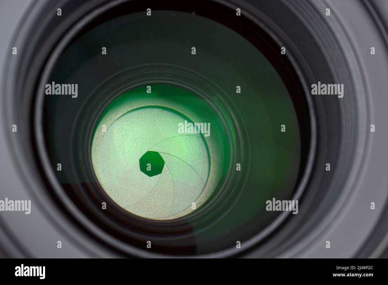 Modern lens with open aperture Stock Photo - Alamy