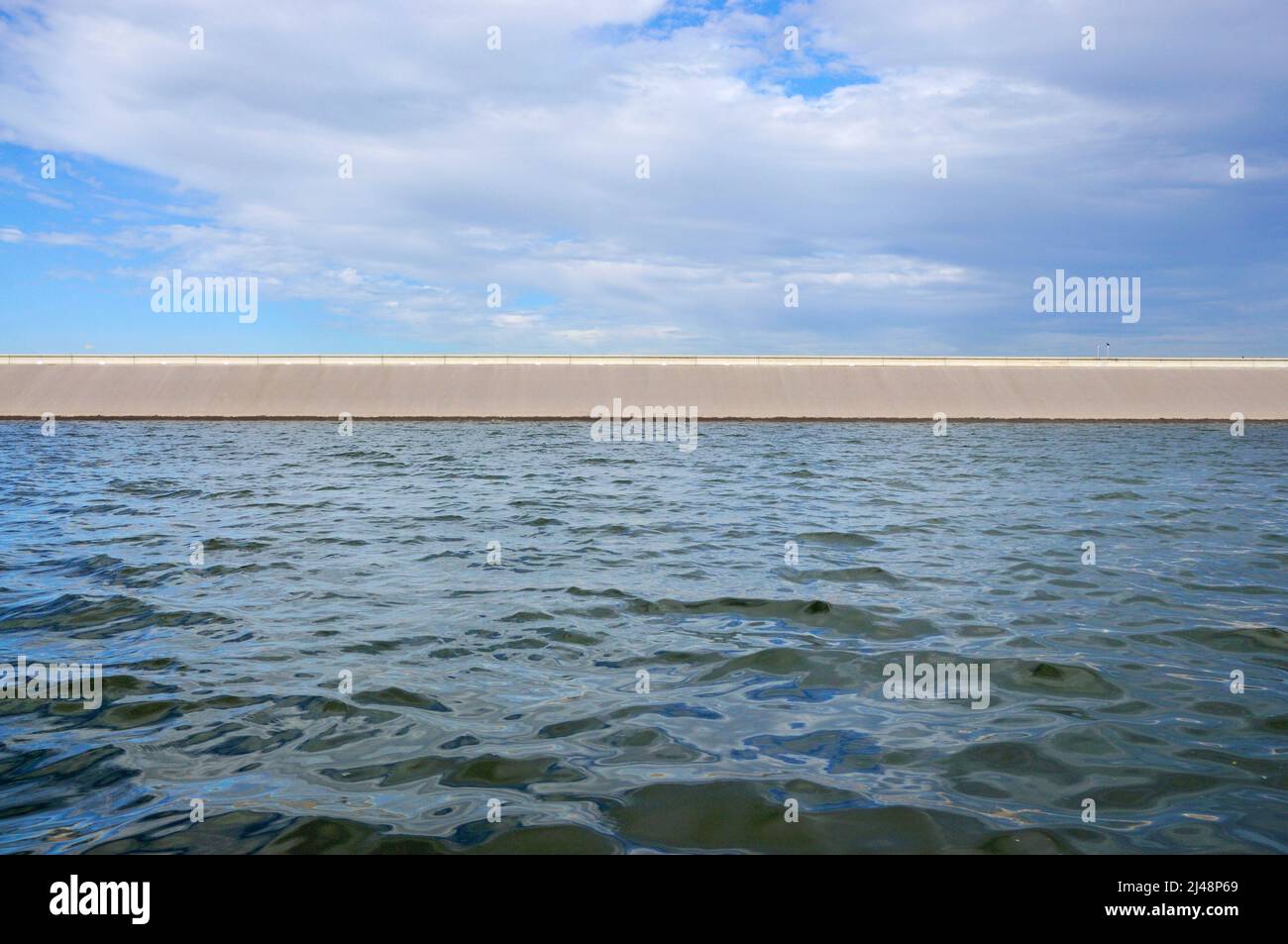 Reservoir with dam in the background Stock Photo - Alamy