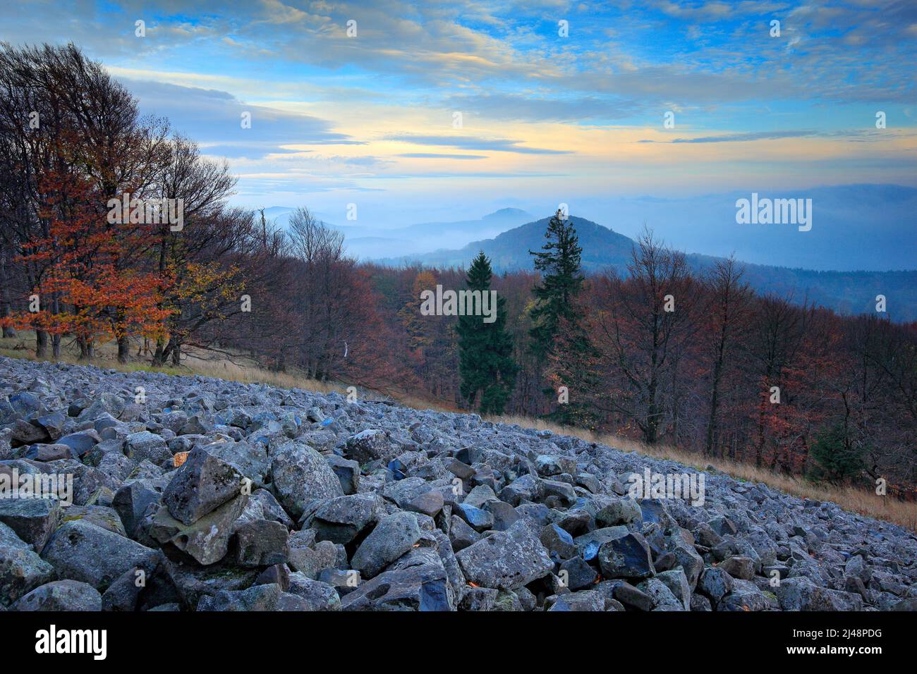 Stone of sea, scree slope landscape with blue evening sky, autumn ...