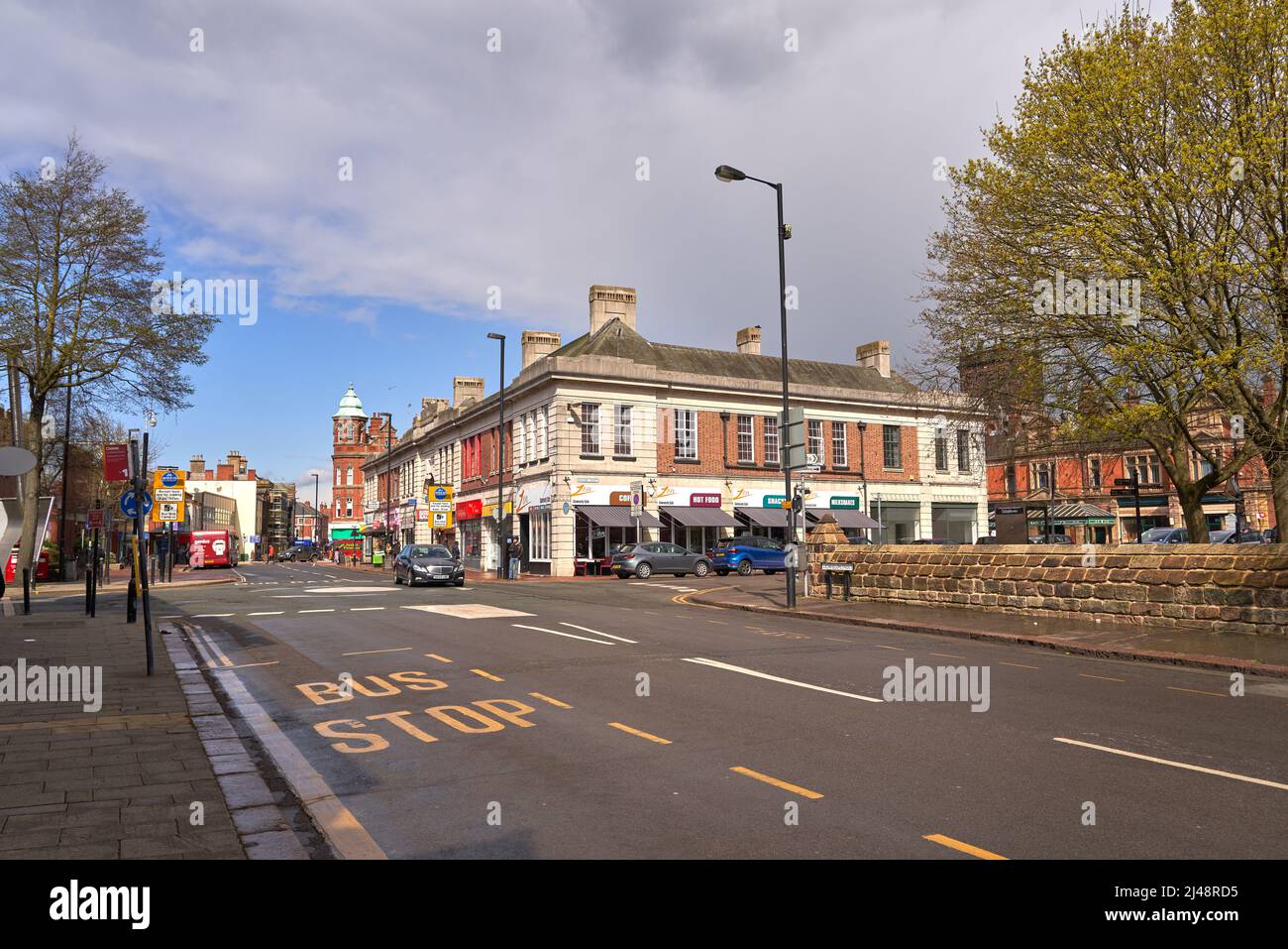Main road and shops in a town center Stock Photo - Alamy