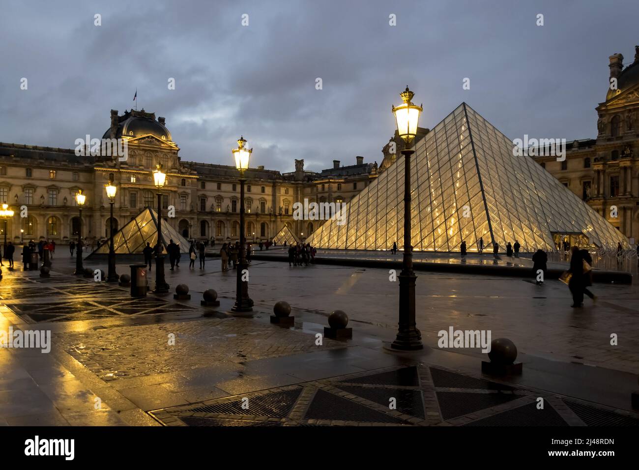 Urban landscape of a sunset at the Louvre Palace, an iconic building of ...