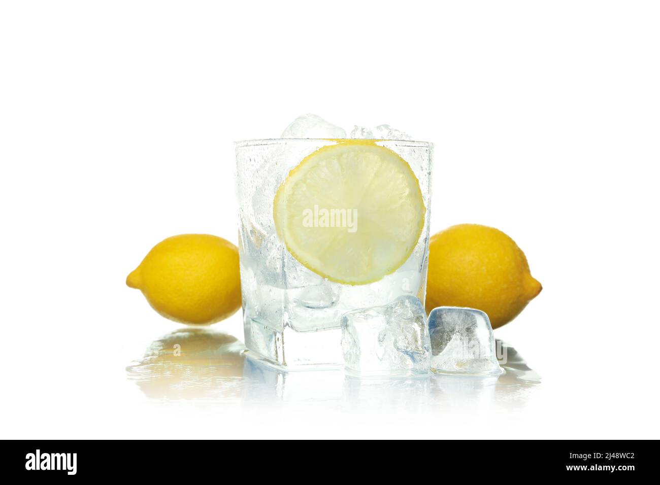 Glass with ice and lemon isolated on white background Stock Photo - Alamy