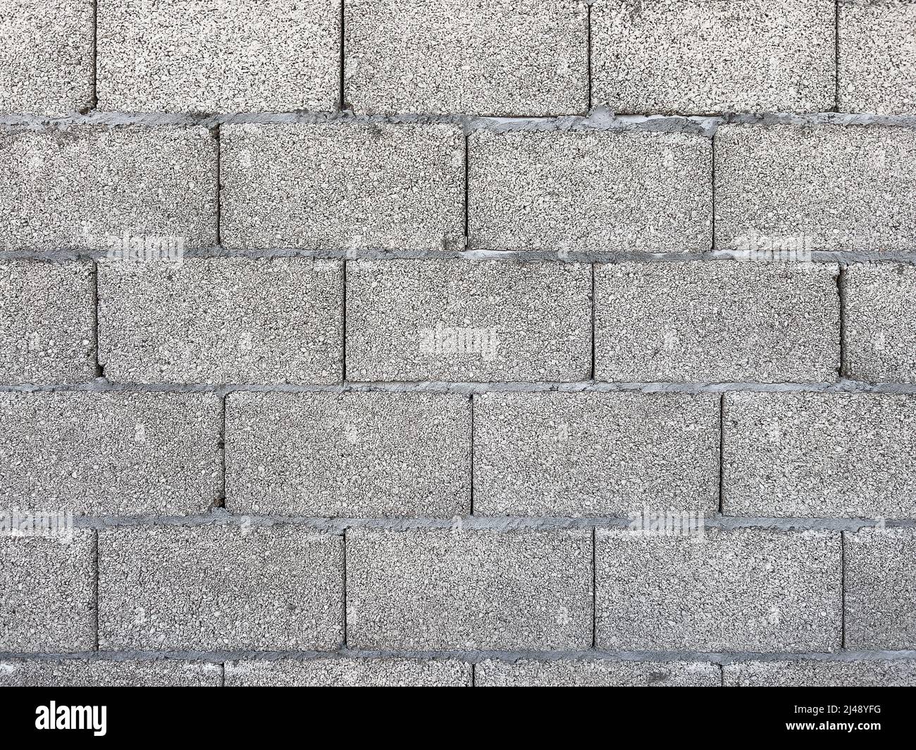 Exterior wall made of concrete blocks as background or construction ...