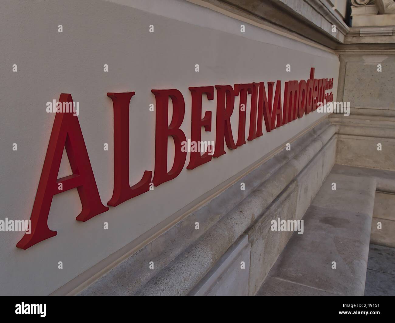 Close-up view of red colored lettering of art museum Albertina modern ...