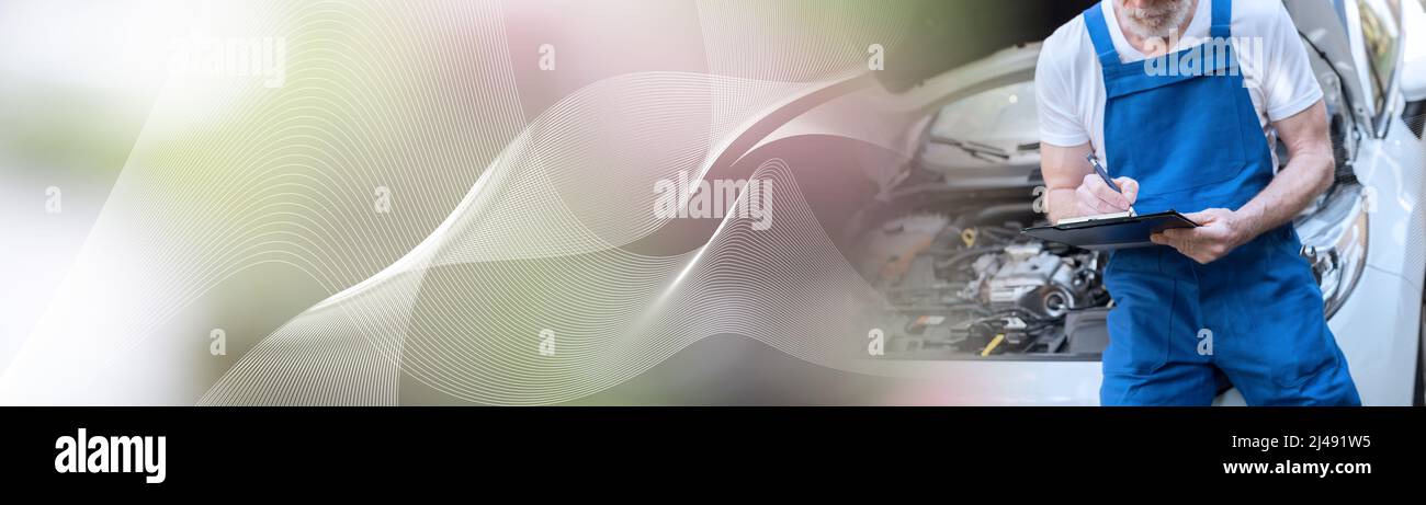 Car mechanic checking a car engine and writing on clipboard; panoramic ...