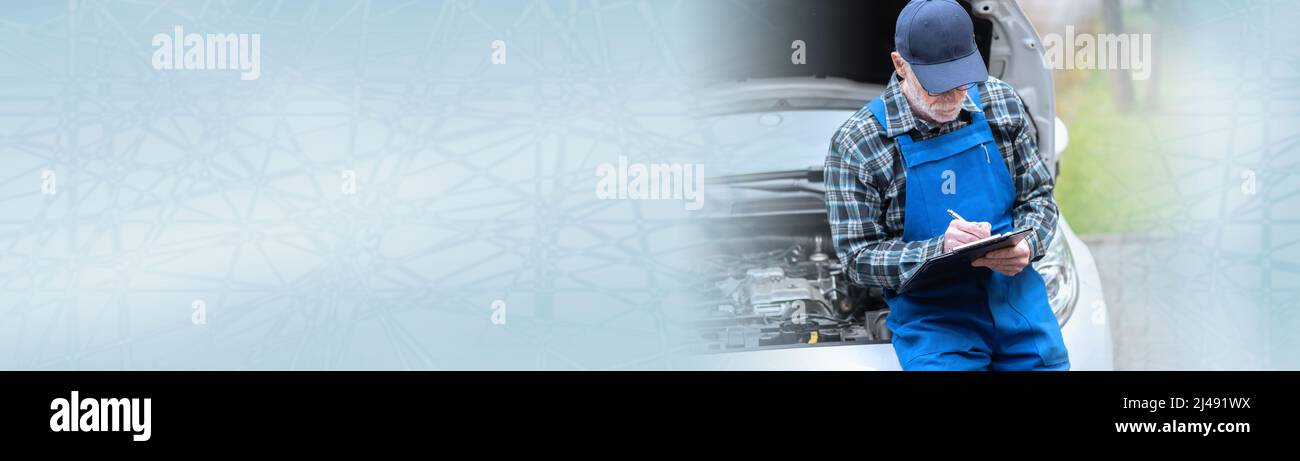 Car mechanic checking a car engine and writing on clipboard; panoramic ...