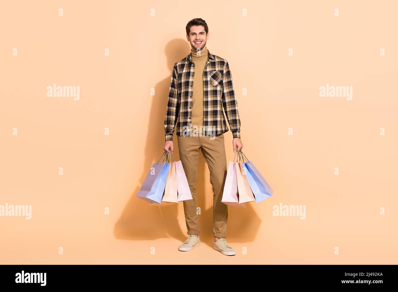Full body photo of positive guy hold many packages bought specials ...
