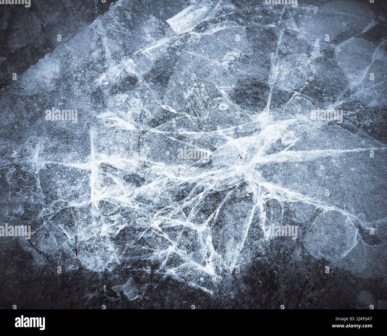 Cracks on the ice surface abstract Stock Photo - Alamy