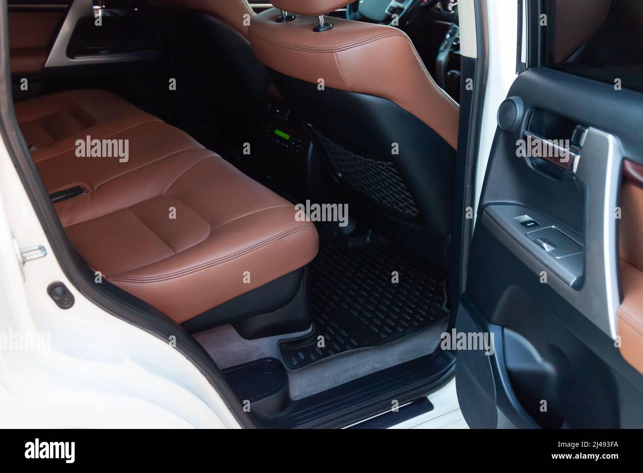 Car inside rear passenger place. Brown interior of prestige modern car ...