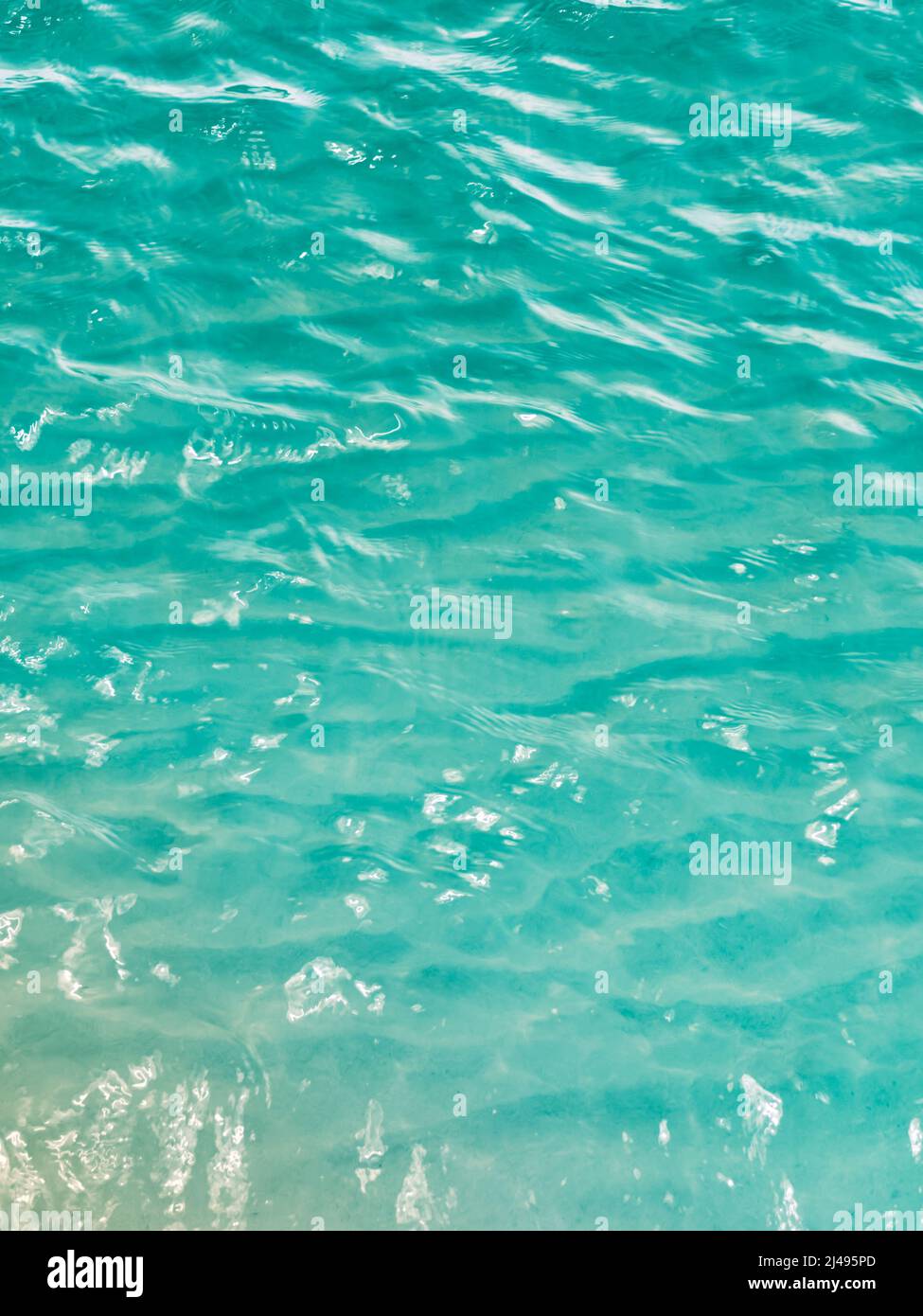 Surface transparent blue sea water Stock Photo - Alamy