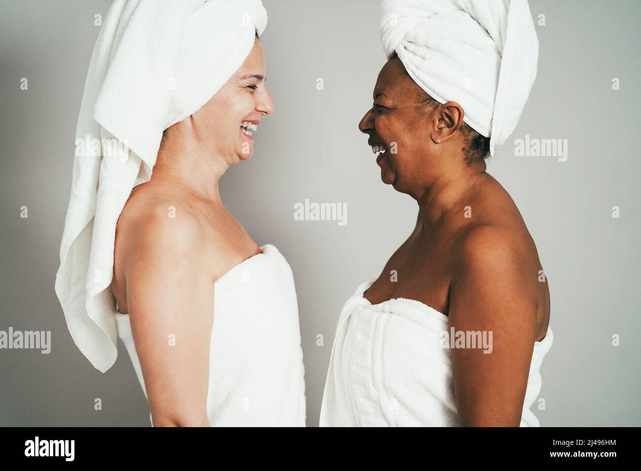 Multiracial senior women with diverse skin and body laughing together ...