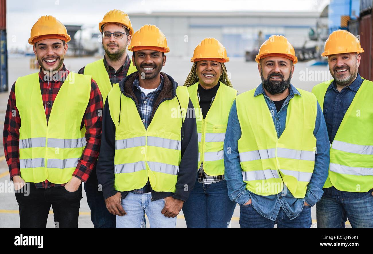 Multiracial people working together at industrial port outdoor - Focus ...