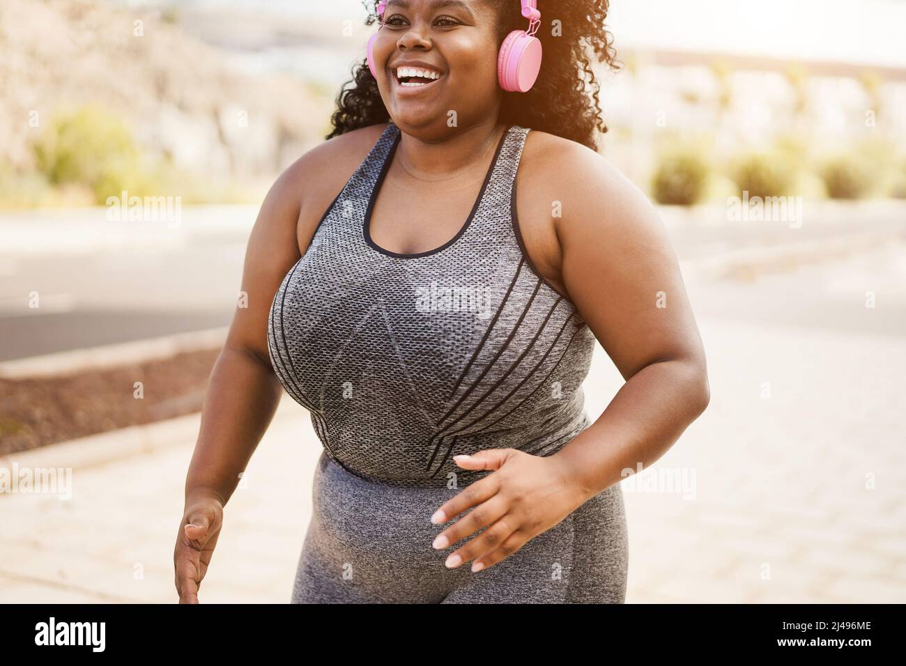 Plus size woman run hi-res stock photography and images - Alamy
