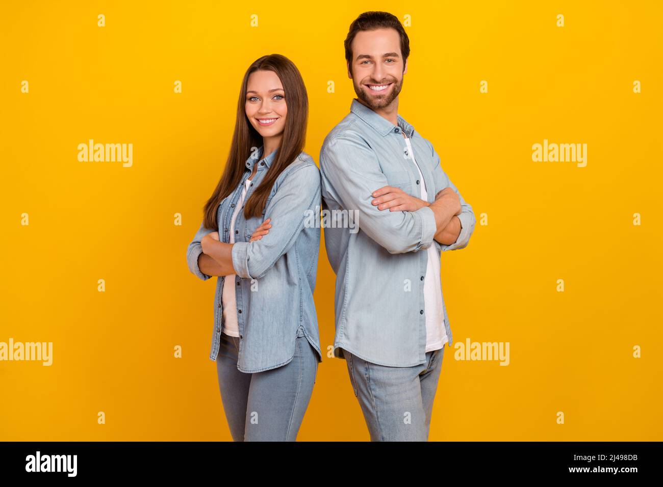 Photo of confident charming sister brother dressed denim shirts arms ...