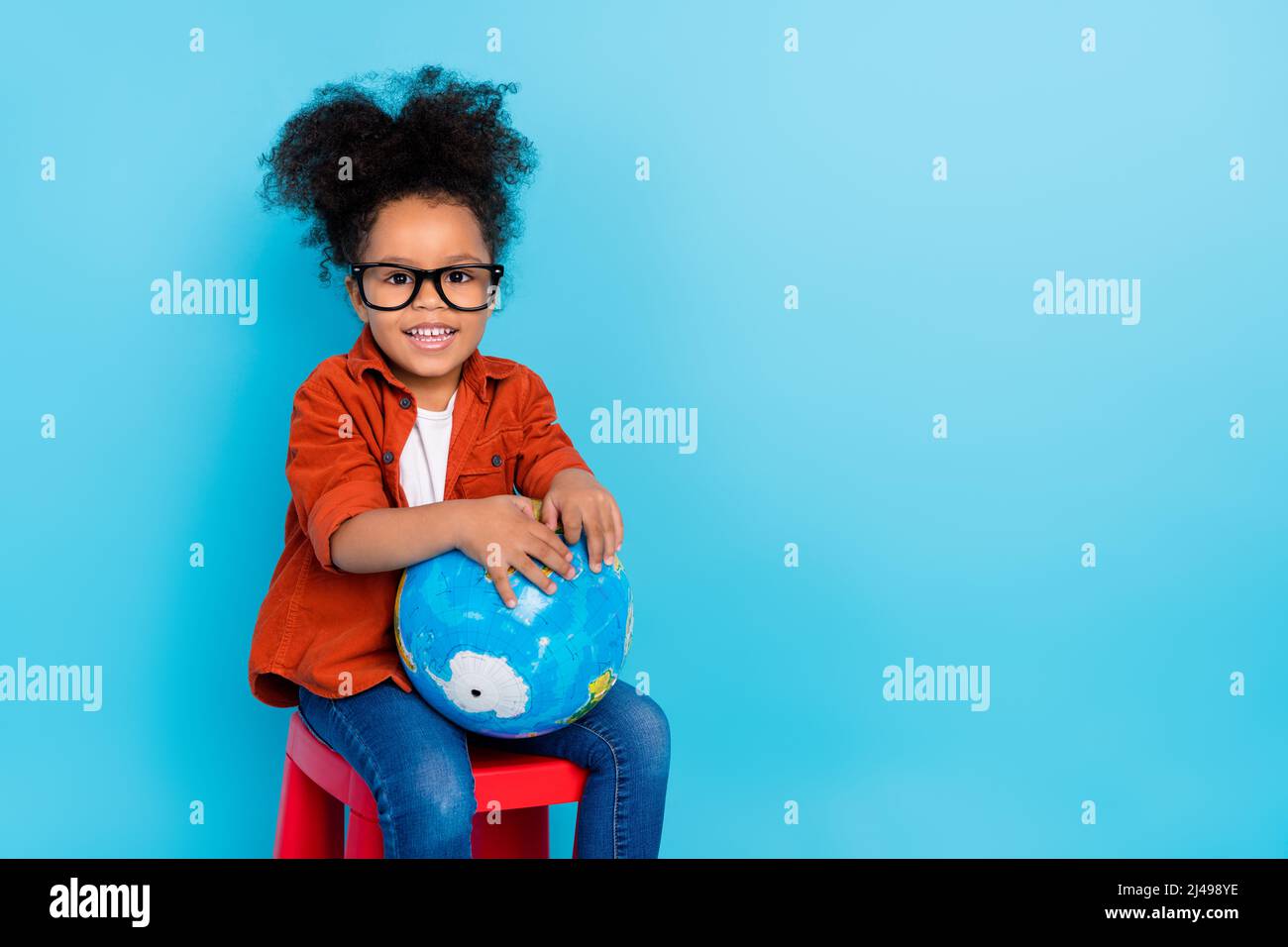 Photo of cute pretty little girl sitting small chair during lesson ...