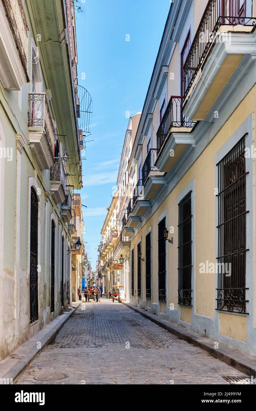 Narrow paved street of old Havana, Cuba. Facades of colonial buildings ...