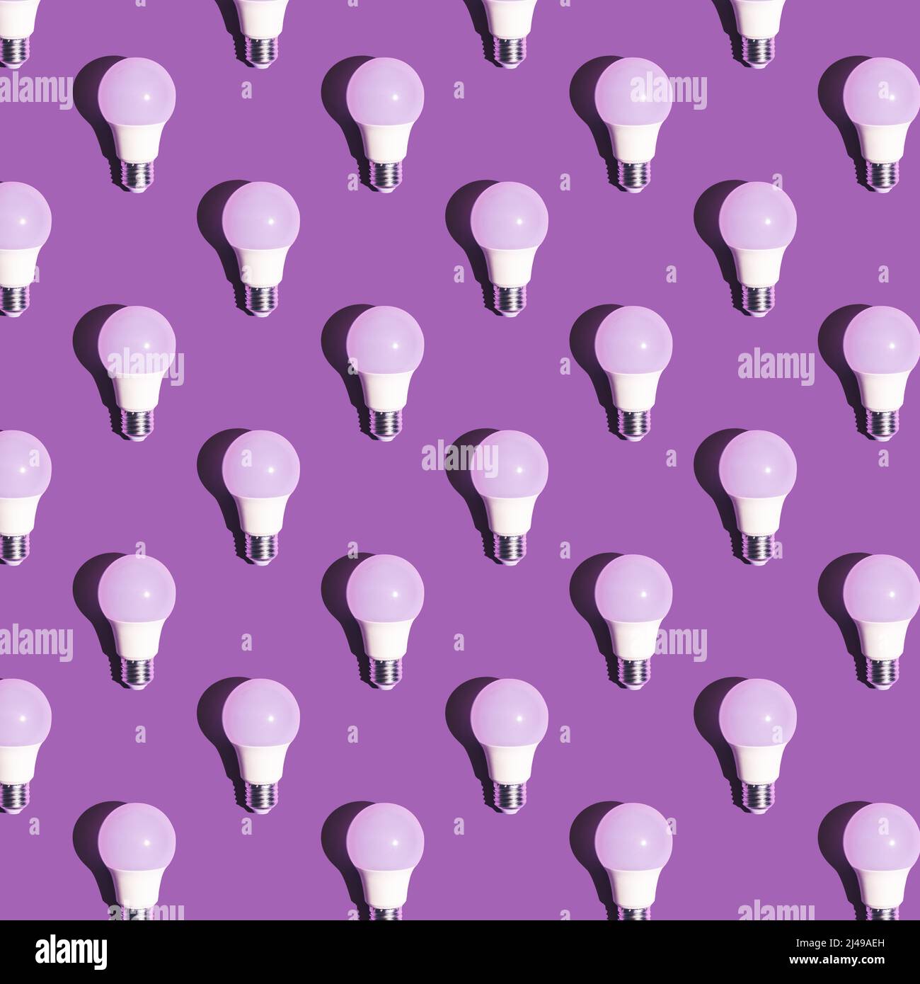 Pattern made of led bulb lamp on pastel purple background. Top view ...