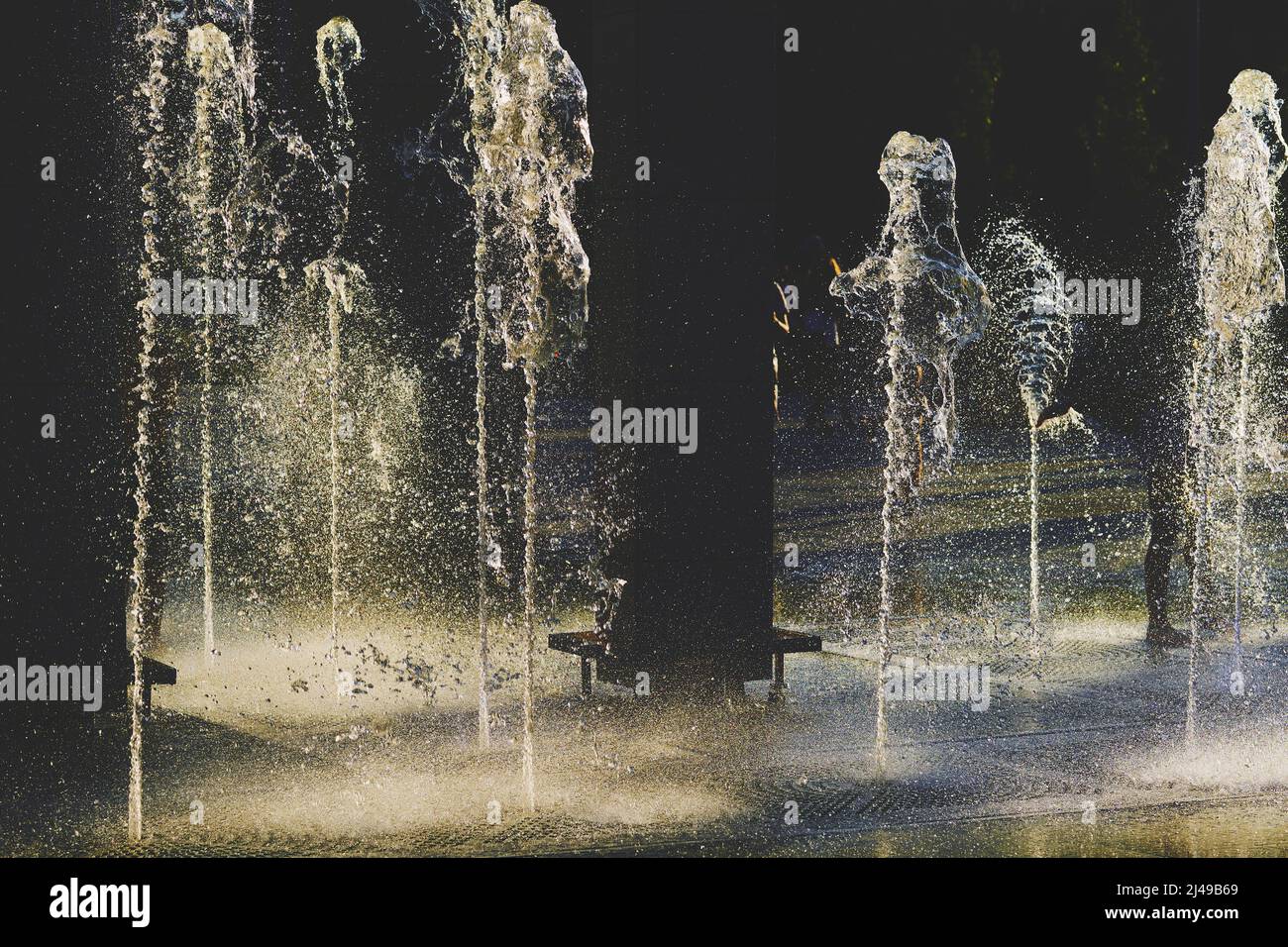 Cool water fountains flow in the summer heat Stock Photo - Alamy