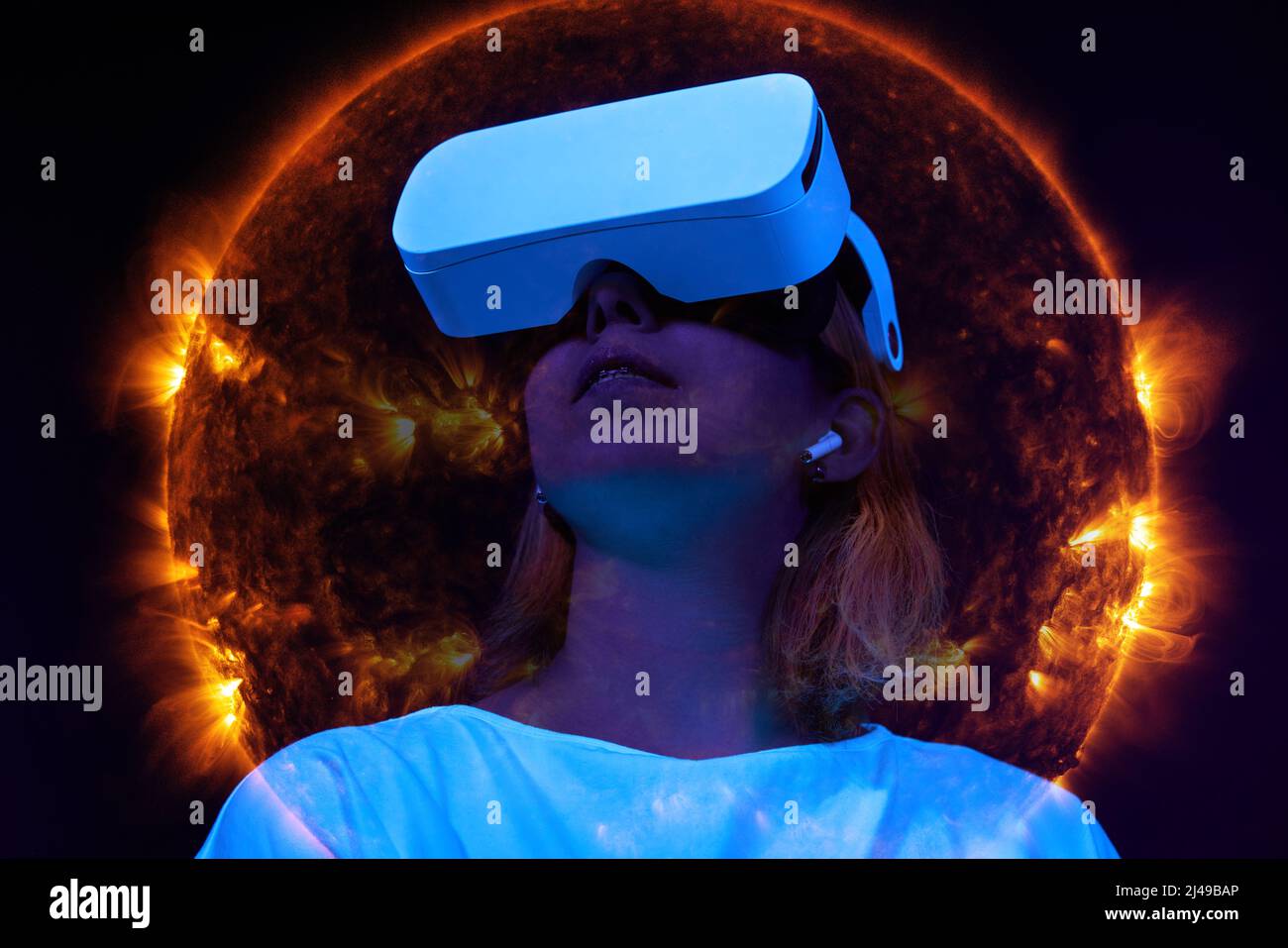 Woman uses a virtual reality headset to see the far corners of space ...