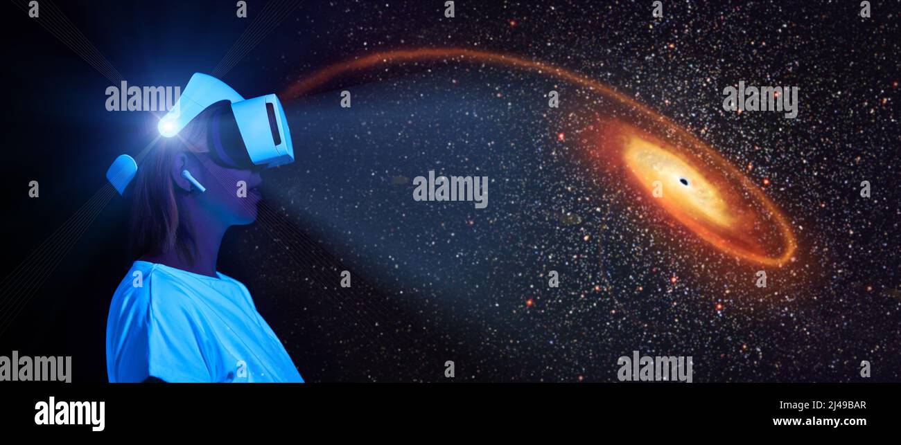 Woman uses a virtual reality headset to see the far corners of space ...