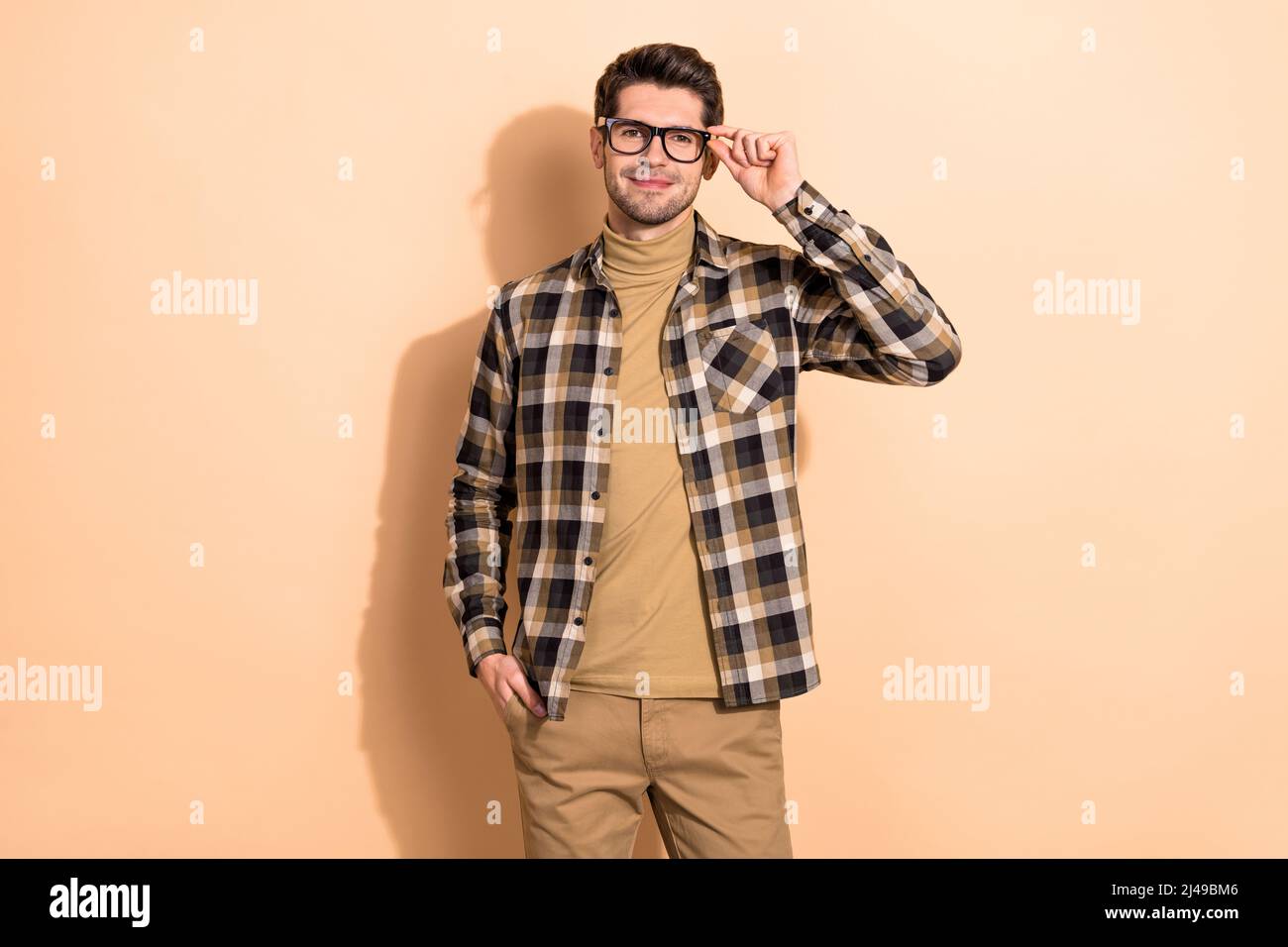 Portrait of attractive content skilled intellectual guy touching specs ...