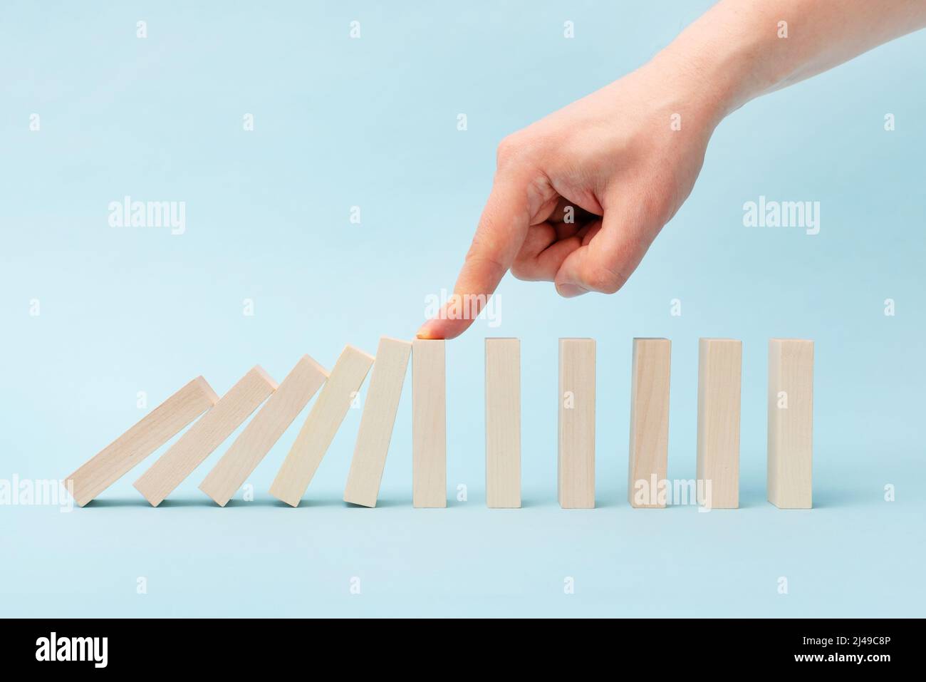 Domino effect control hi-res stock photography and images - Alamy