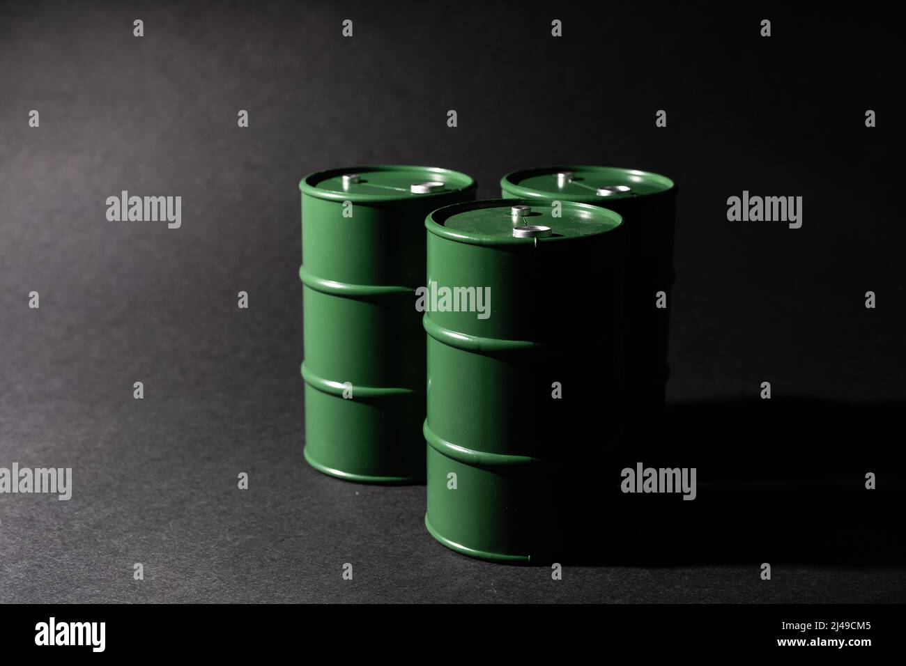 tin barrels on black background isolated close up, one round oil drum ...