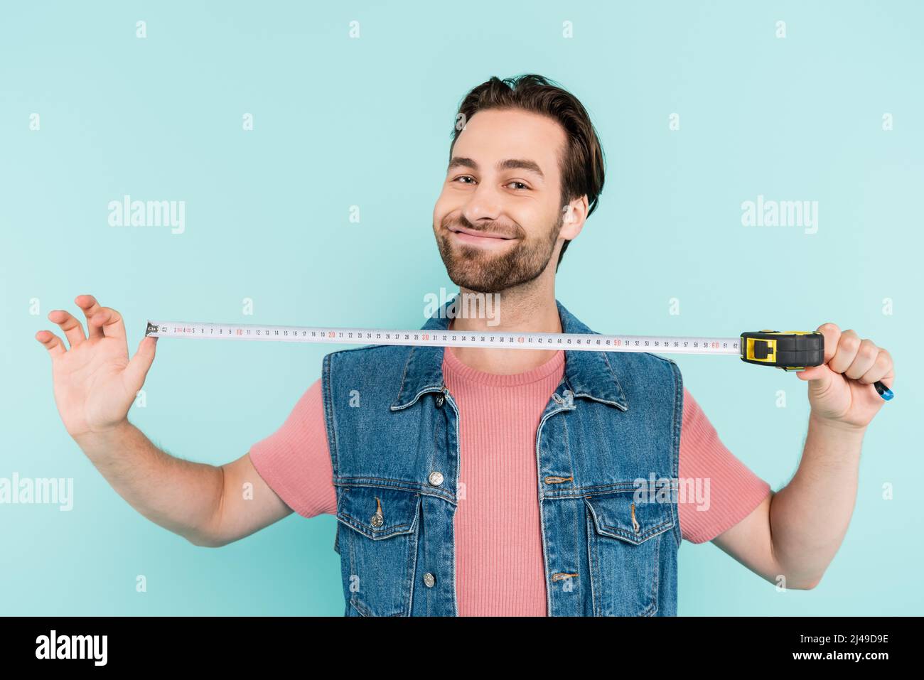 Man holding tape measure isolated hi-res stock photography and images ...