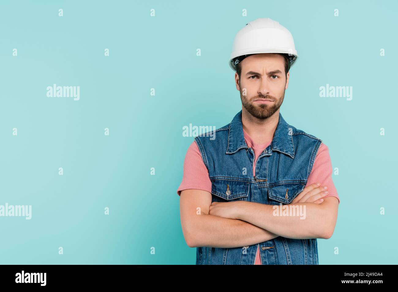 Serious man crossing arms hi-res stock photography and images - Alamy