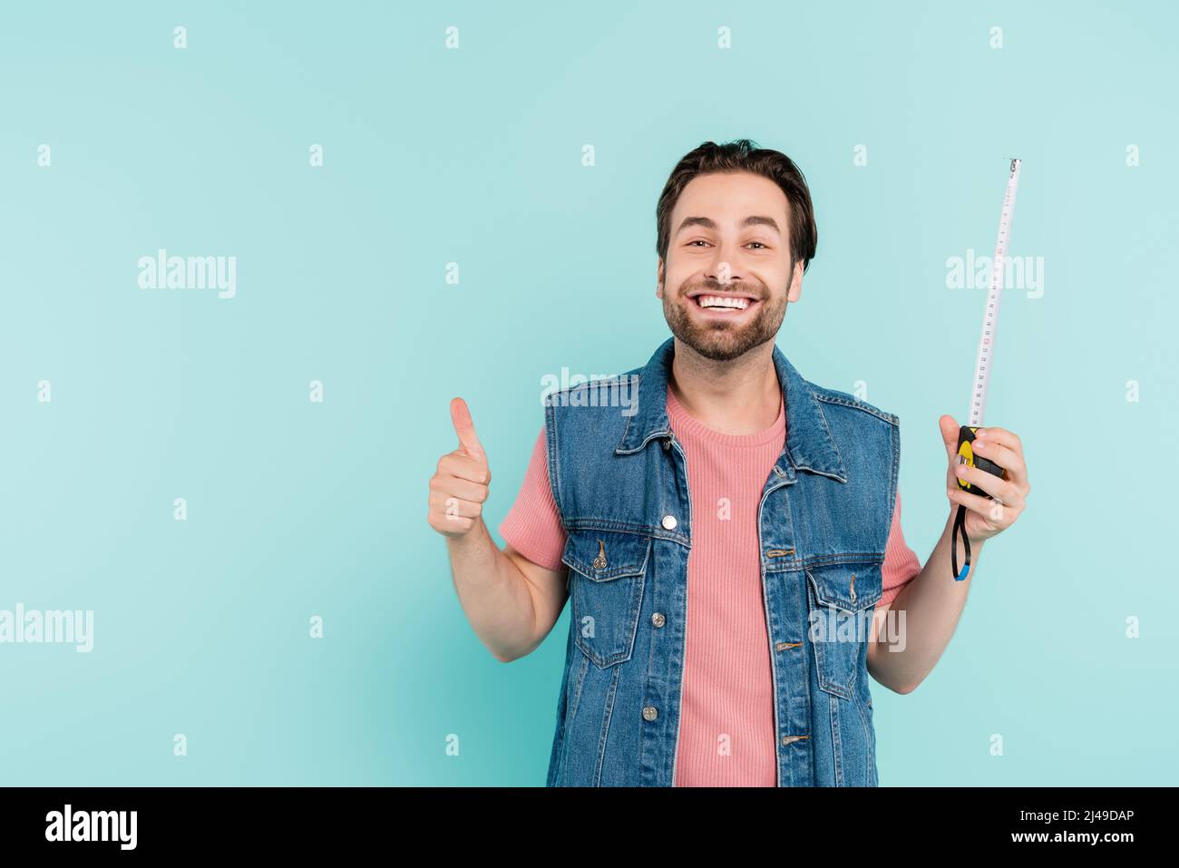 Man holding tape measure isolated hi-res stock photography and images ...