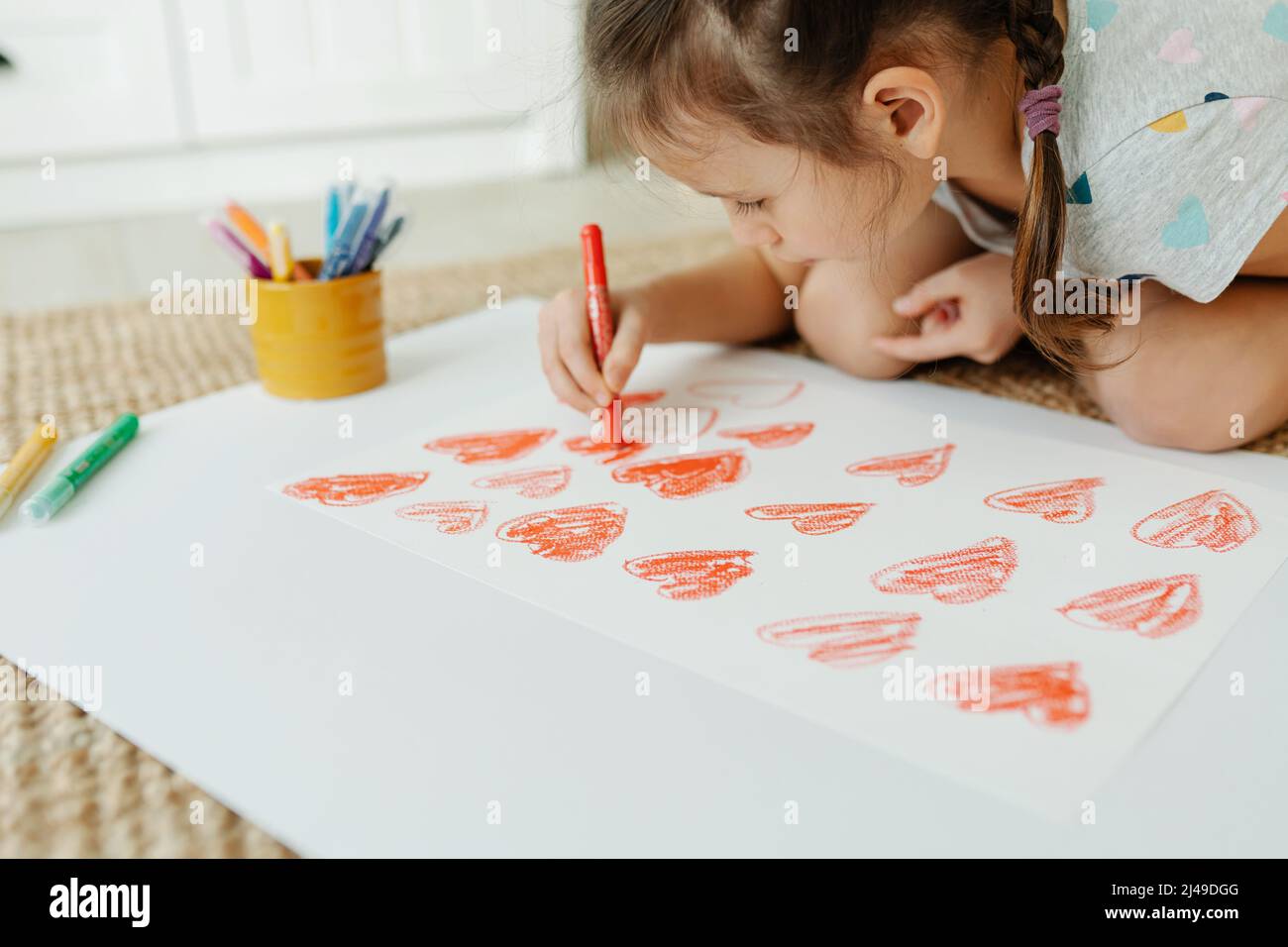 Child drawing a lot of hearts Stock Photo - Alamy