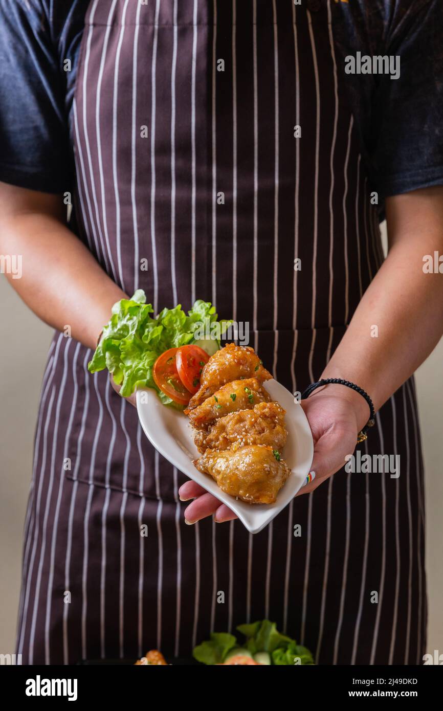 Person holding a plate of Korean fried rice, ready to serve Stock Photo ...