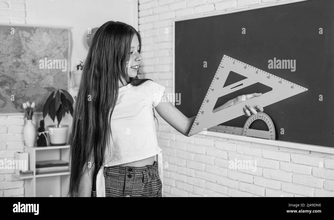 teen girl work in classroom with math tools. cheerful kid learning ...