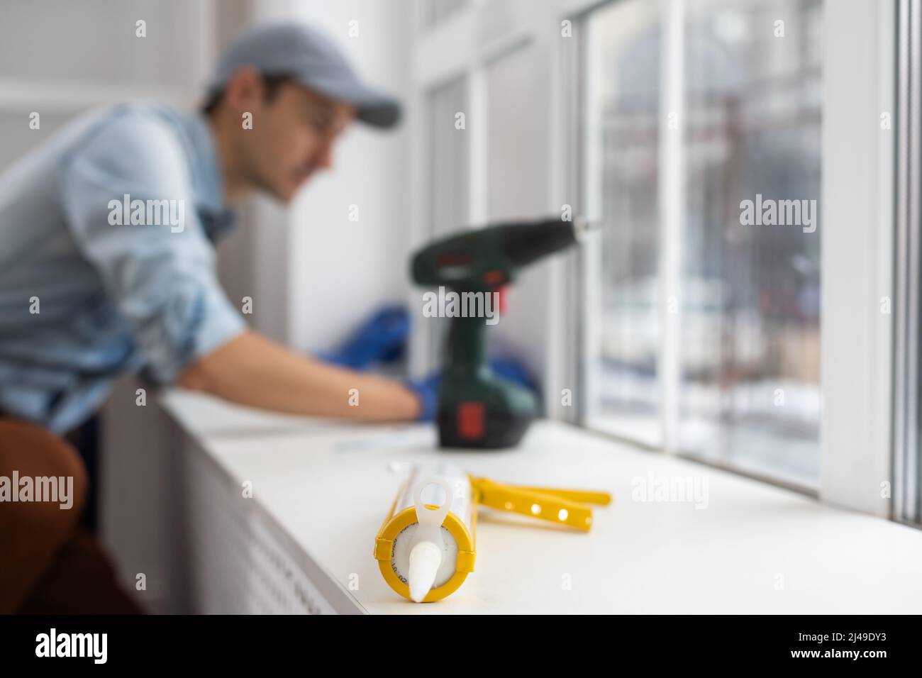 The worker installing and checking window in the house Stock Photo - Alamy