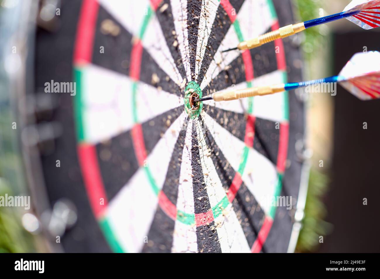 Game darts with dart in center closeup Stock Photo - Alamy