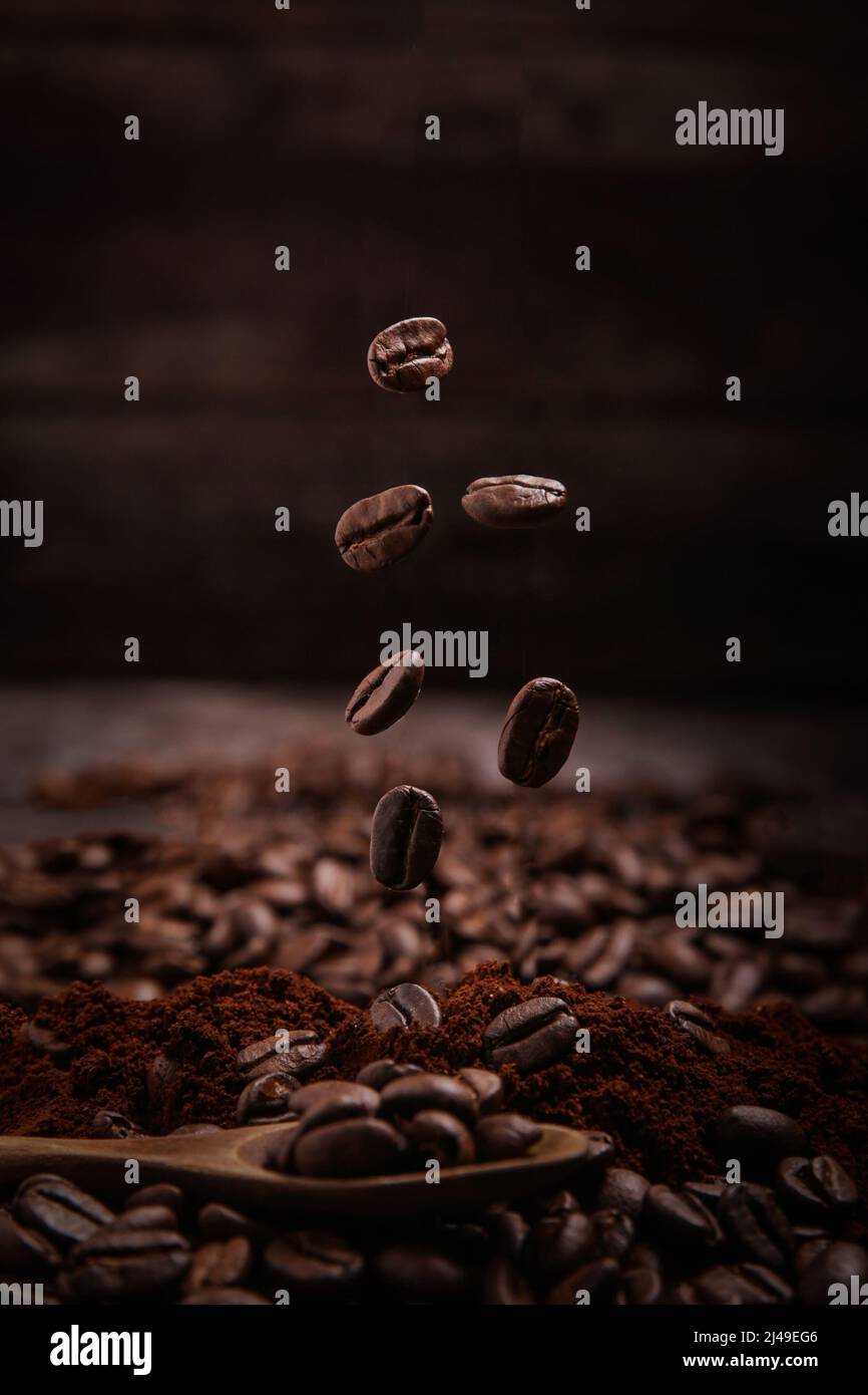 Coffee beans floating in a black scene, select the focal point Stock ...