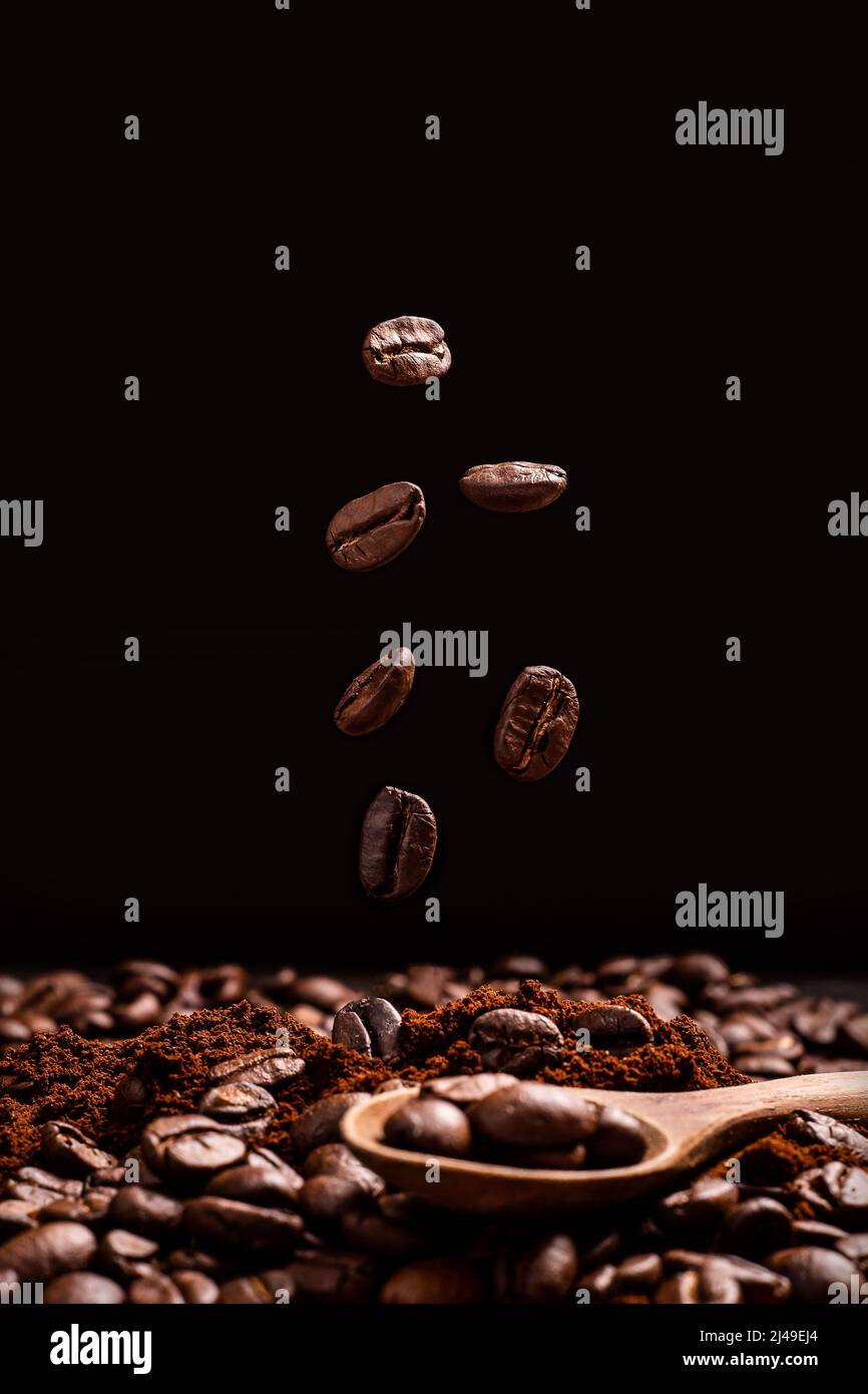 Coffee beans floating in a black scene, select the focal point Stock ...