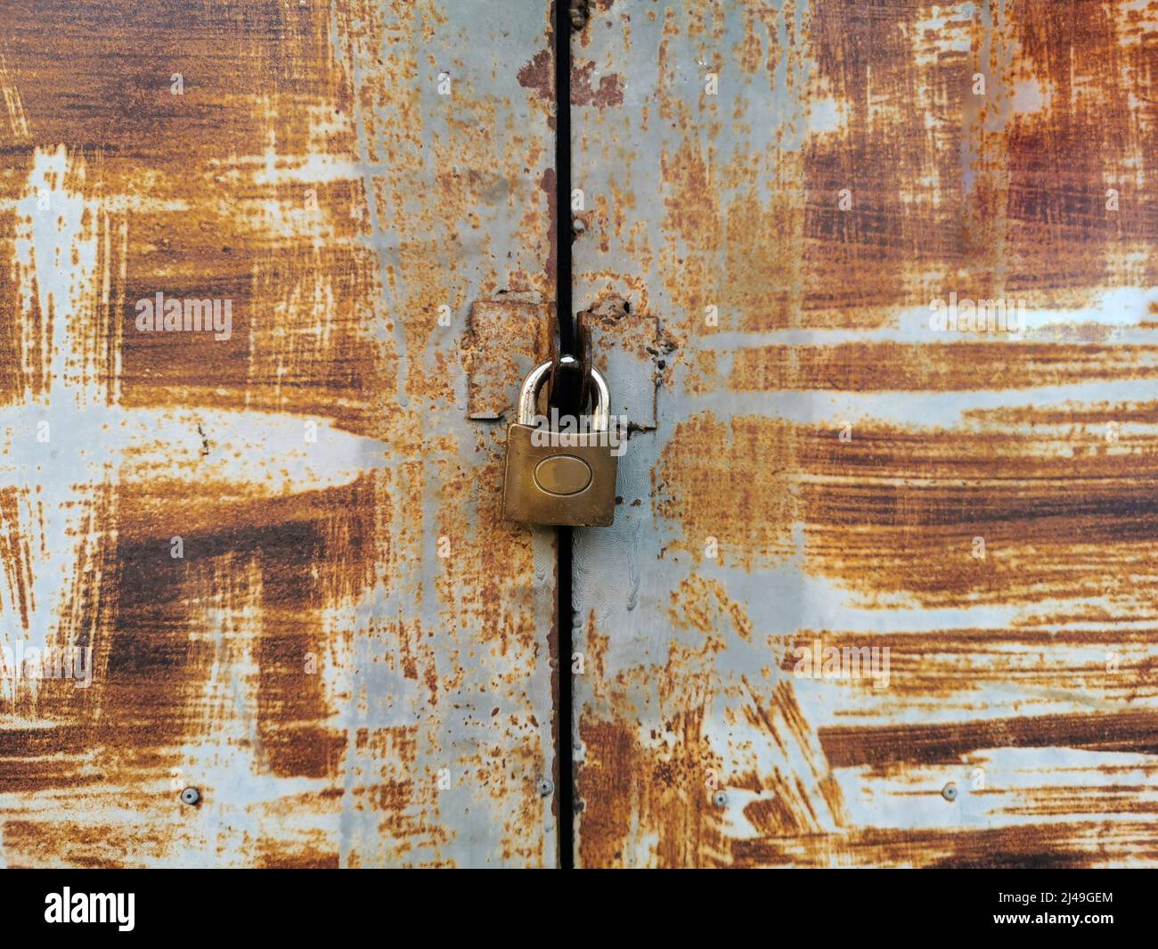 Old Rustic Metal Door with Brass Padlock Safeguard Background Stock ...