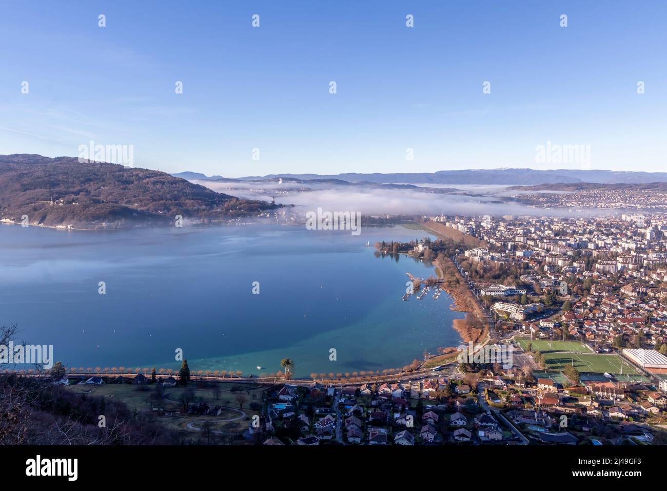 Aerial sunrise view of Annecy lake waterfront and old town with ...