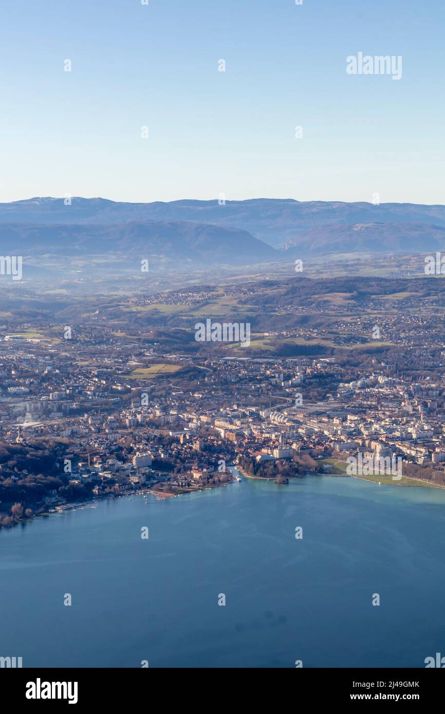 Aerial sunrise view of Annecy lake waterfront and old town with ...