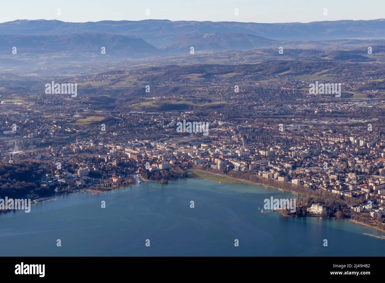 Aerial sunrise view of Annecy lake waterfront and old town with ...