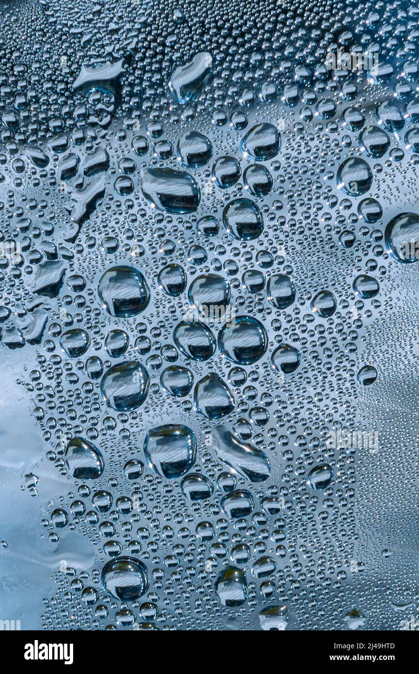 Water drops on blue background. Water droplets on glass surface Stock ...