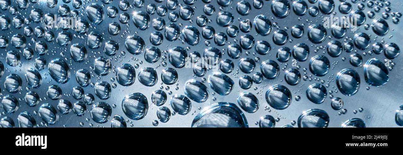 Banner of water drops on blue background. Water droplets on glass ...