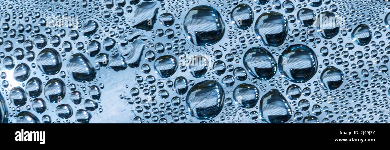 Banner of water drops on blue background. Water droplets on glass ...