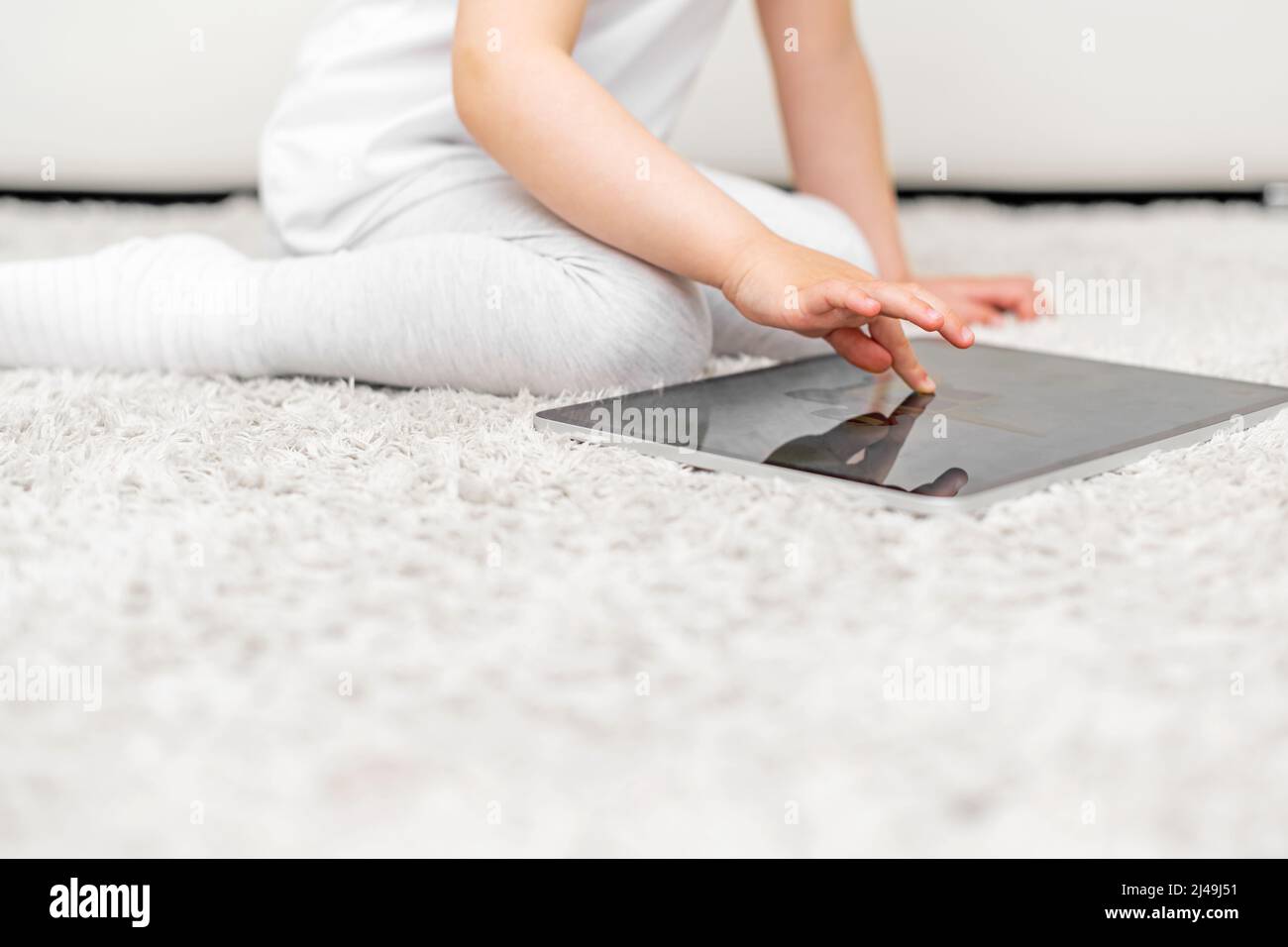 Tablet child holding screen hi-res stock photography and images - Alamy